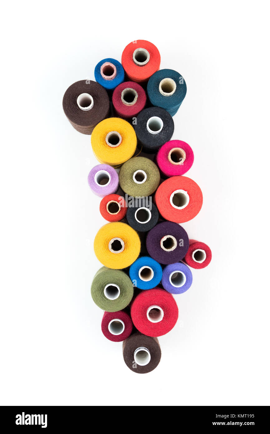 Set of colored thread coils on white background, sewing and tailoring ...