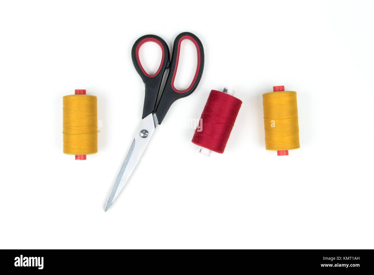 Colored sewing thread coils with scissors on white background Stock ...