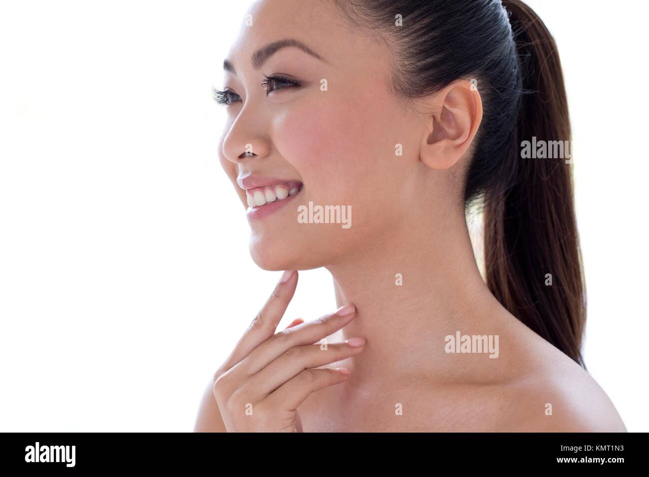 Young woman touching chin,portrait Stock Photo - Alamy