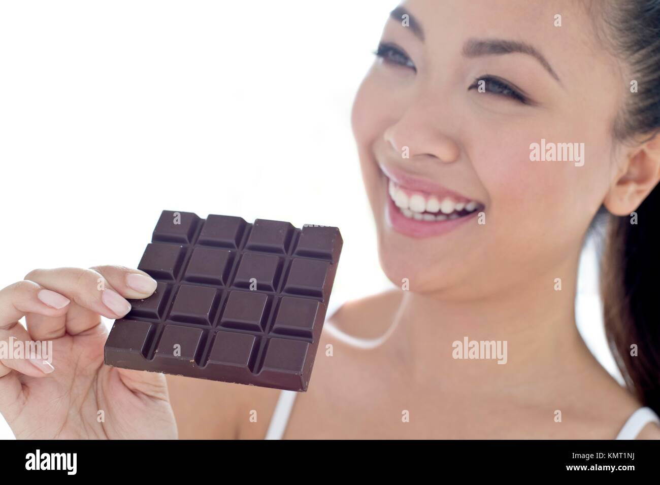 Young woman holding chocolate,portrait Stock Photo - Alamy