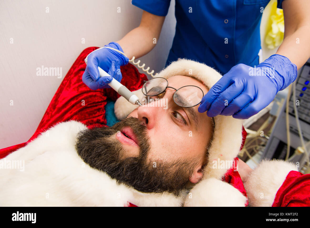 Santa Claus receiving facial beauty treatment Stock Photo - Alamy