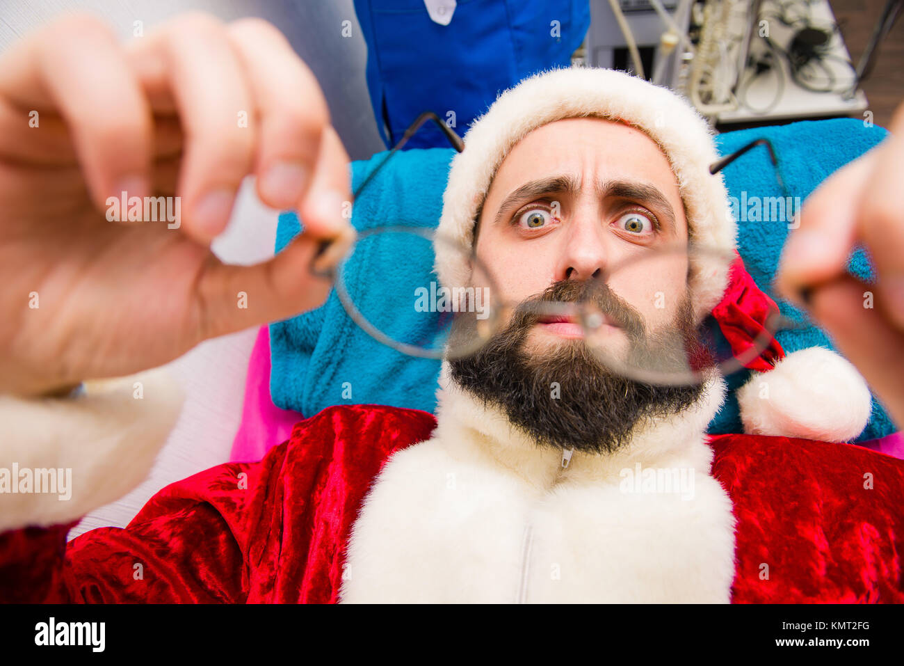 Christmas man in Santa Claus clothes in beauty spa Stock Photo - Alamy