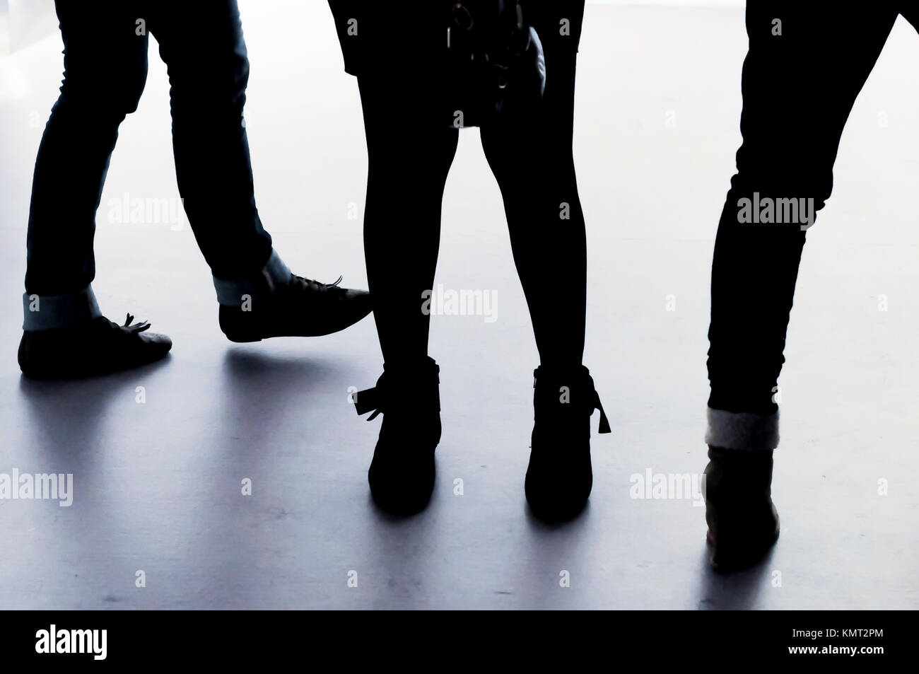 Silhouette standing feet together hi-res stock photography and images ...