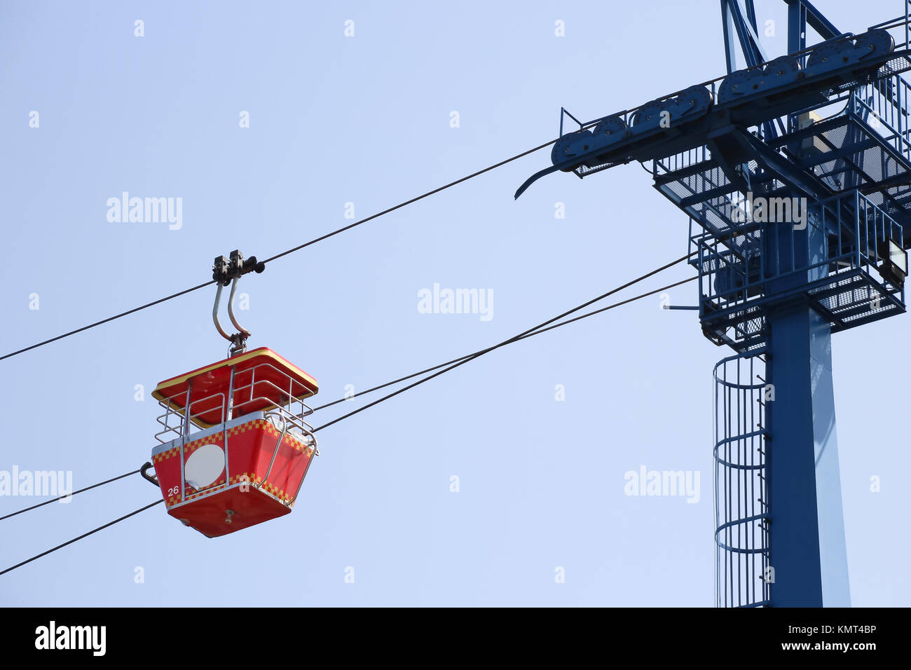Red cable car with blue sky background Stock Photo - Alamy
