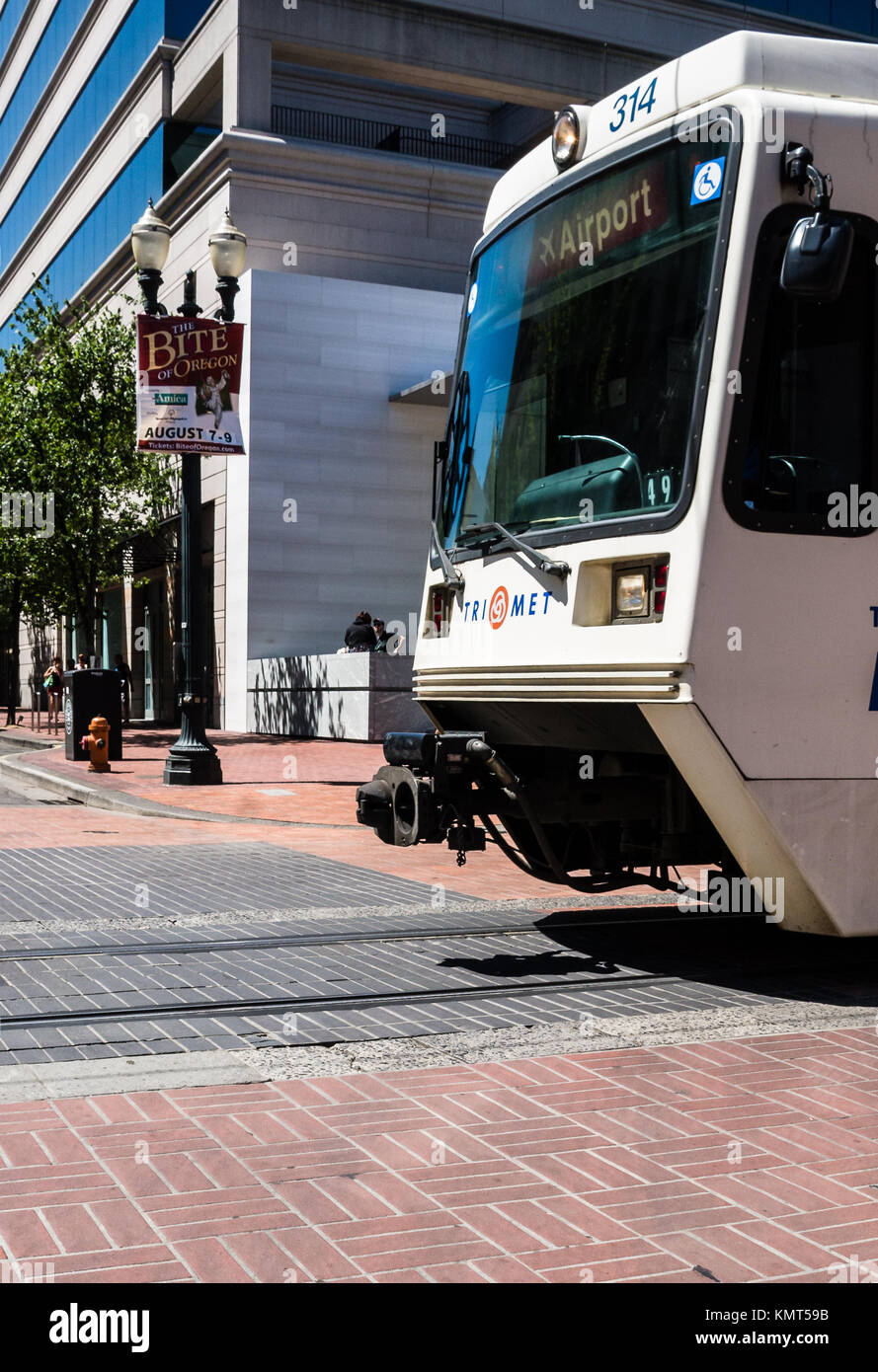Image of a light rail train on a street in Portland Oregon Stock Photo ...