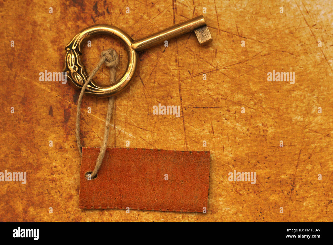 Old key and tag Stock Photo - Alamy