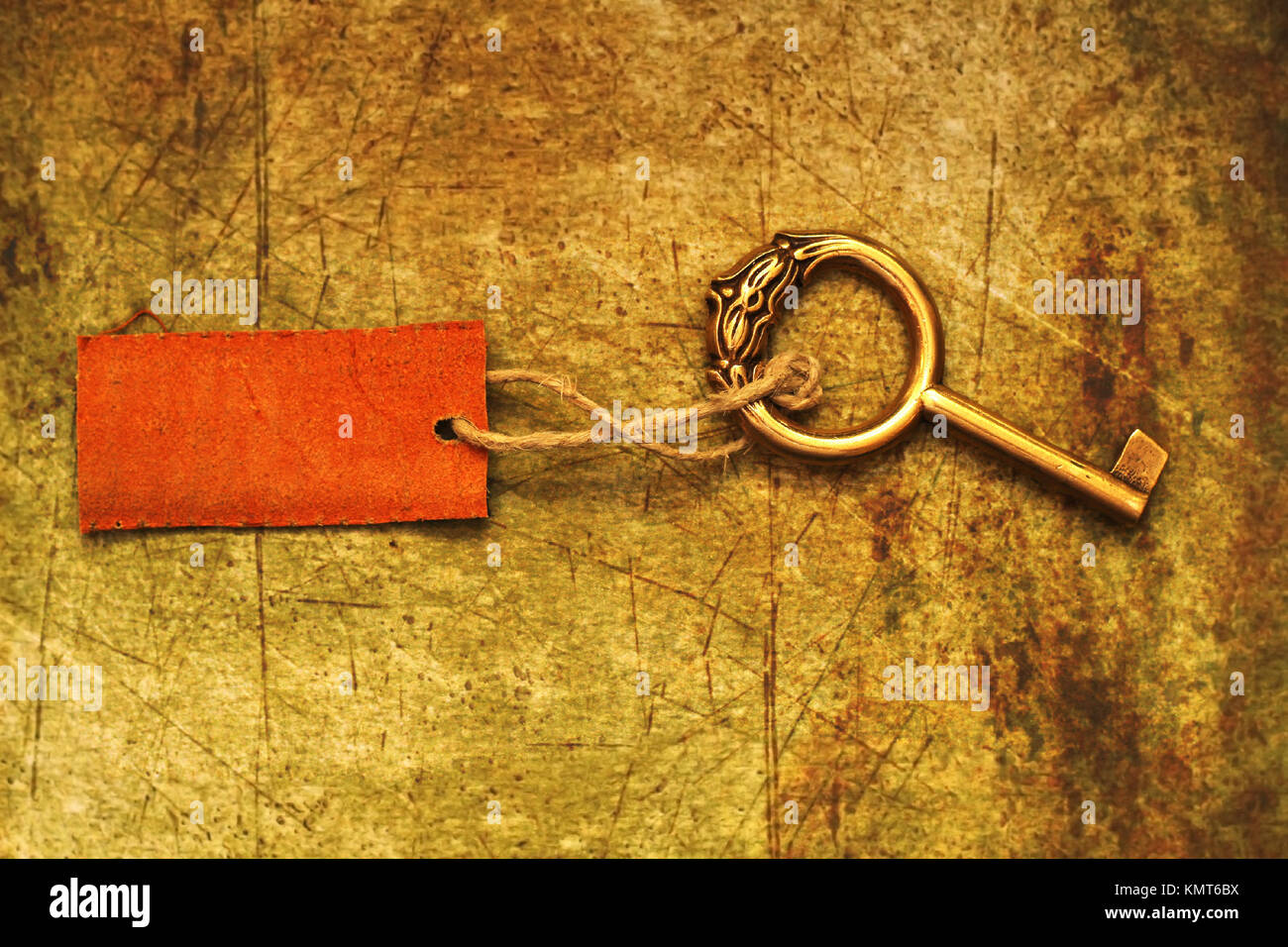 Old key and tag Stock Photo - Alamy