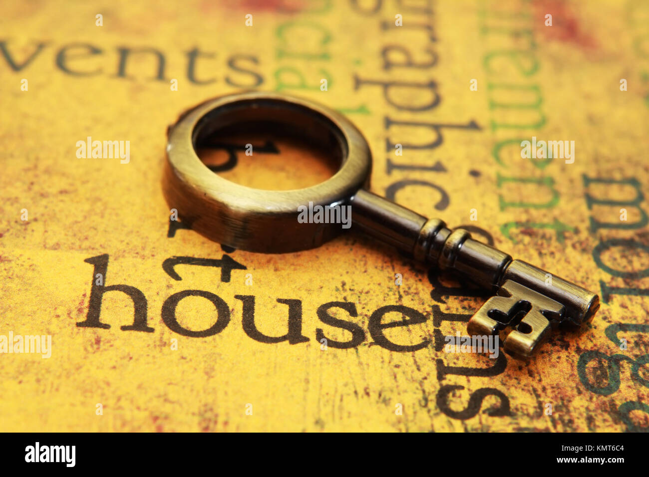 Old key on house text Stock Photo - Alamy