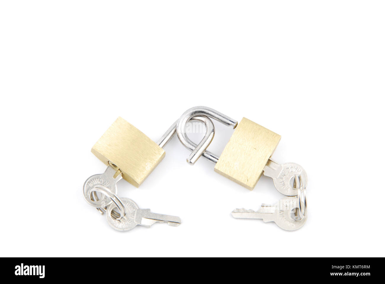 two golden padlocks and keys on white background Stock Photo - Alamy