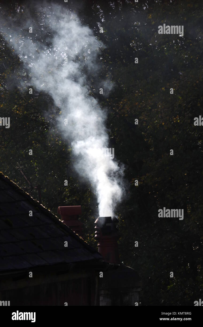 Chimney smoke with dark background Stock Photo - Alamy
