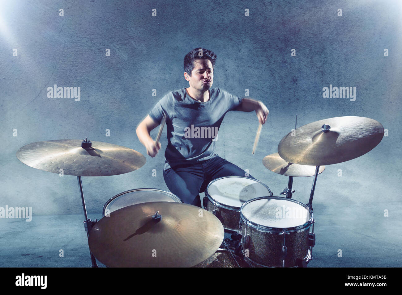 Drummer playing with funny face Stock Photo - Alamy