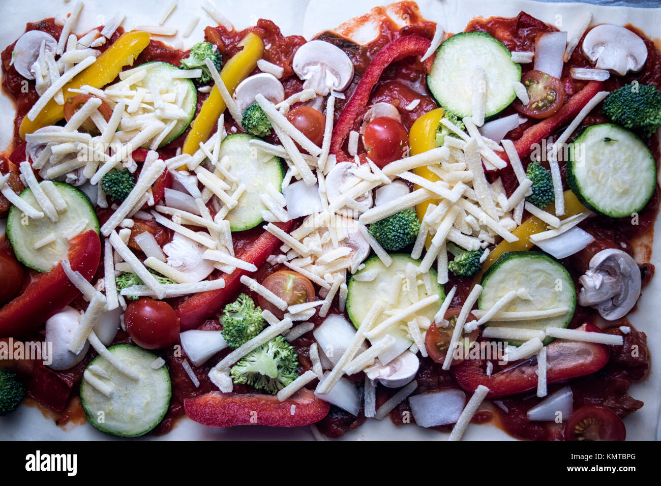 Vegetables around an Uncooked Pizza Base Stock Photo - Alamy