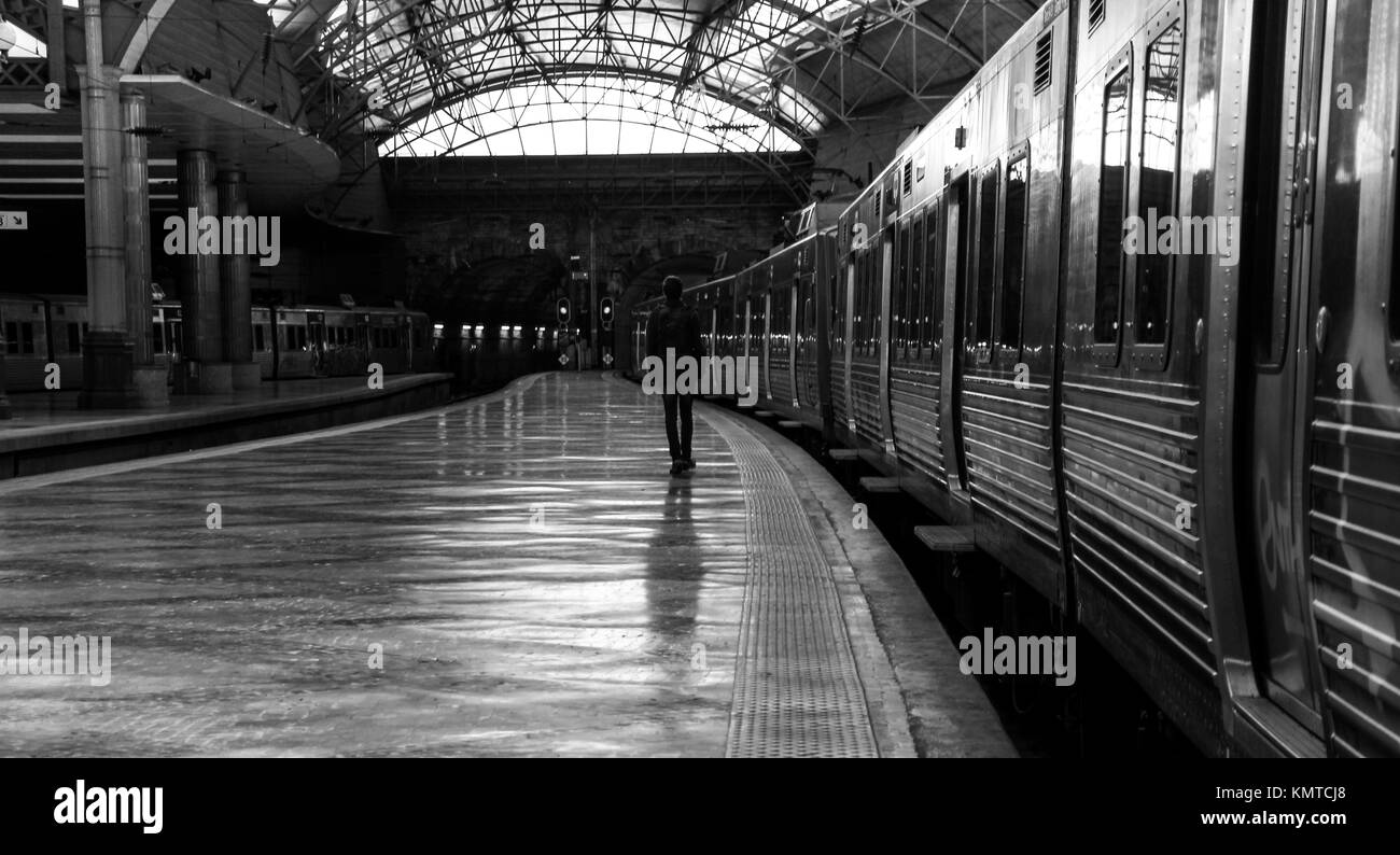 Man walking train station Black and White Stock Photos & Images - Alamy