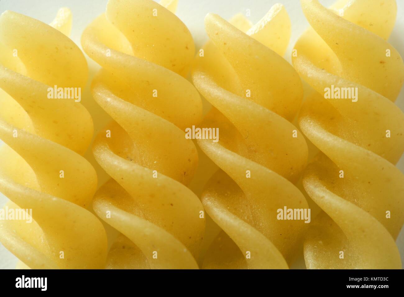 Spiral fusilli dired pasta macro over white studio background Stock ...