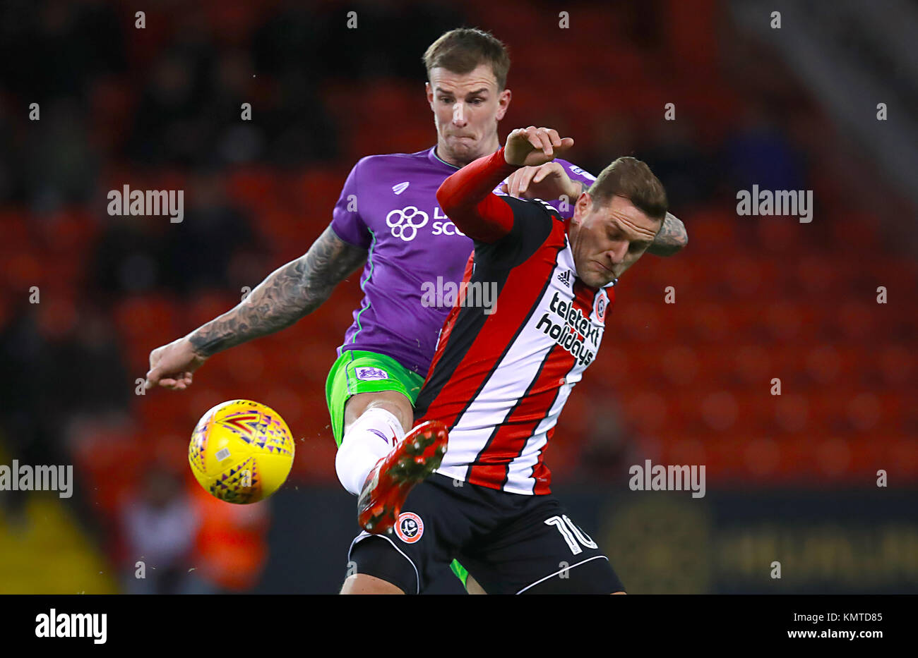 Bristol City's Aden Flint (left) and Sheffield United's Billy Sharp ...