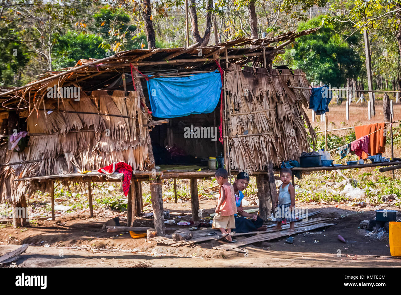 A poor family in a village of workers in the plantation of rubber ...