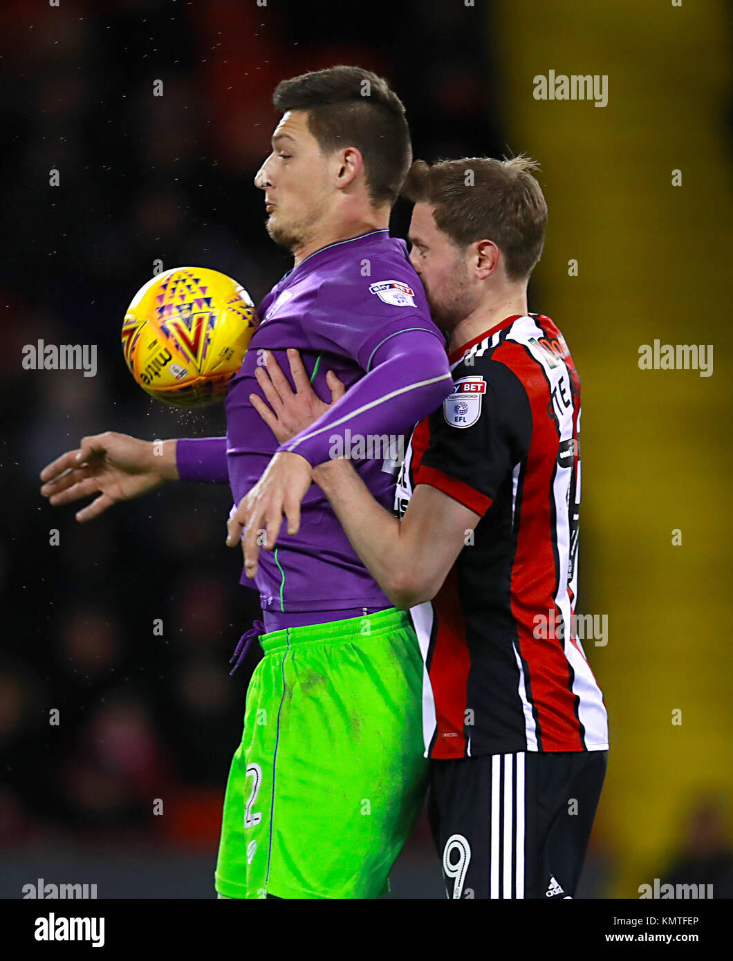 Bristol City's Milan Duric (left) and Sheffield United's Richard ...