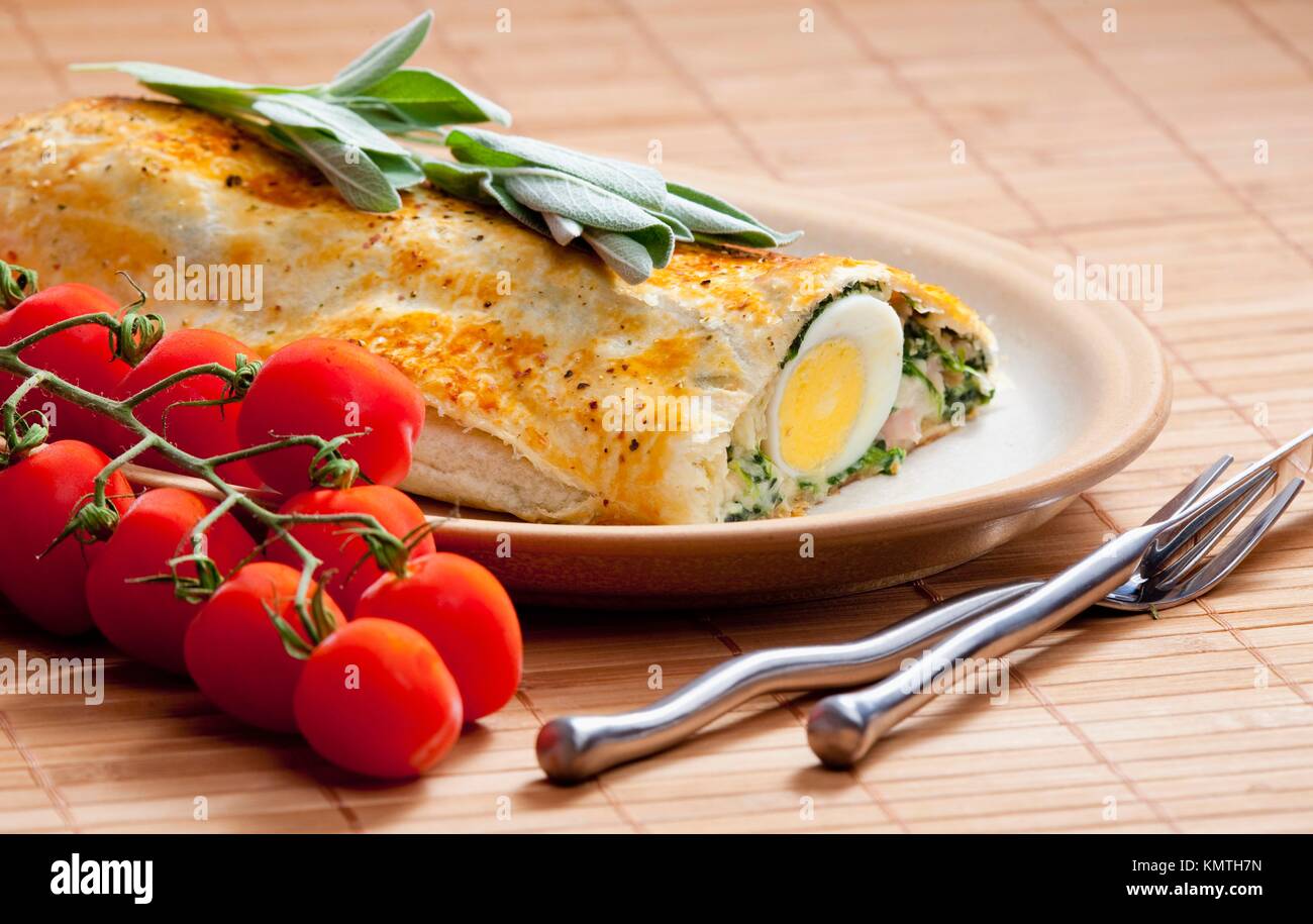 puff roly-poly filled with spinach and eggs Stock Photo - Alamy