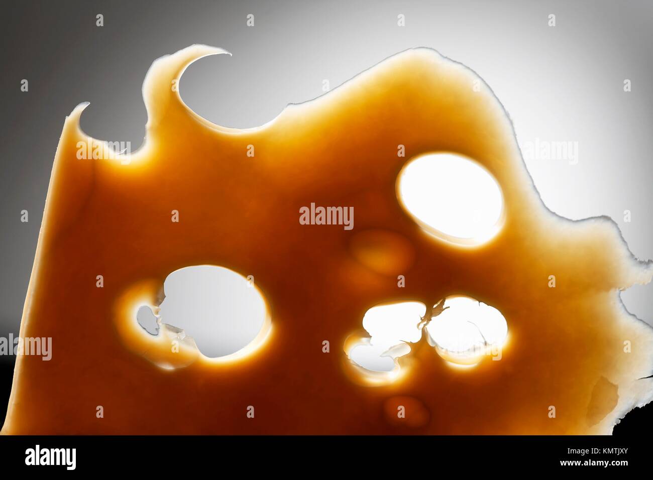 The perfect slice of swiss cheese Close-up view Stock Photo - Alamy