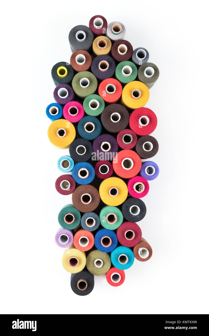 Set of colored thread coils on white background, sewing and tailoring ...