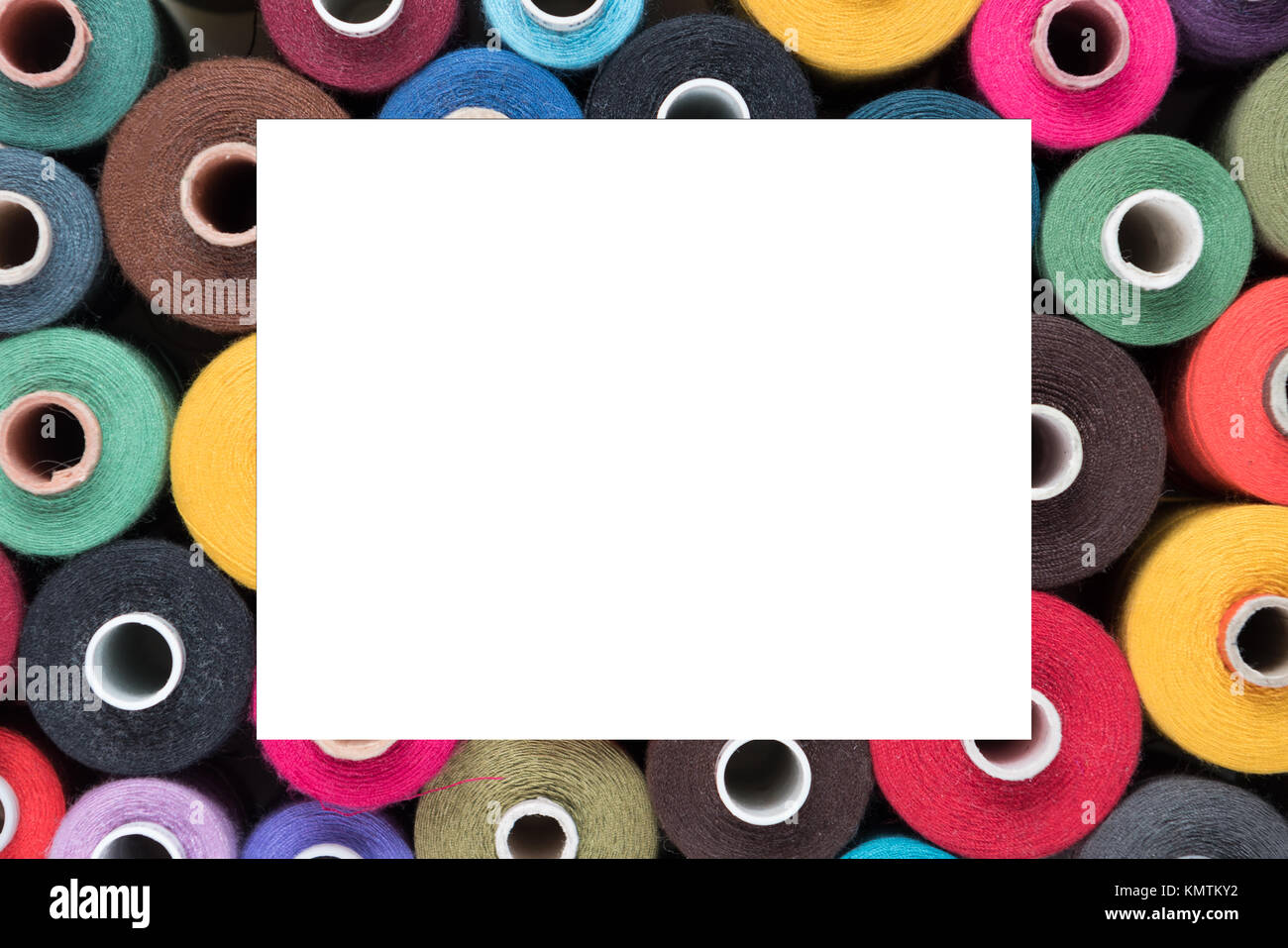Colored Sewing threads as frame, text ready, textile background Stock ...