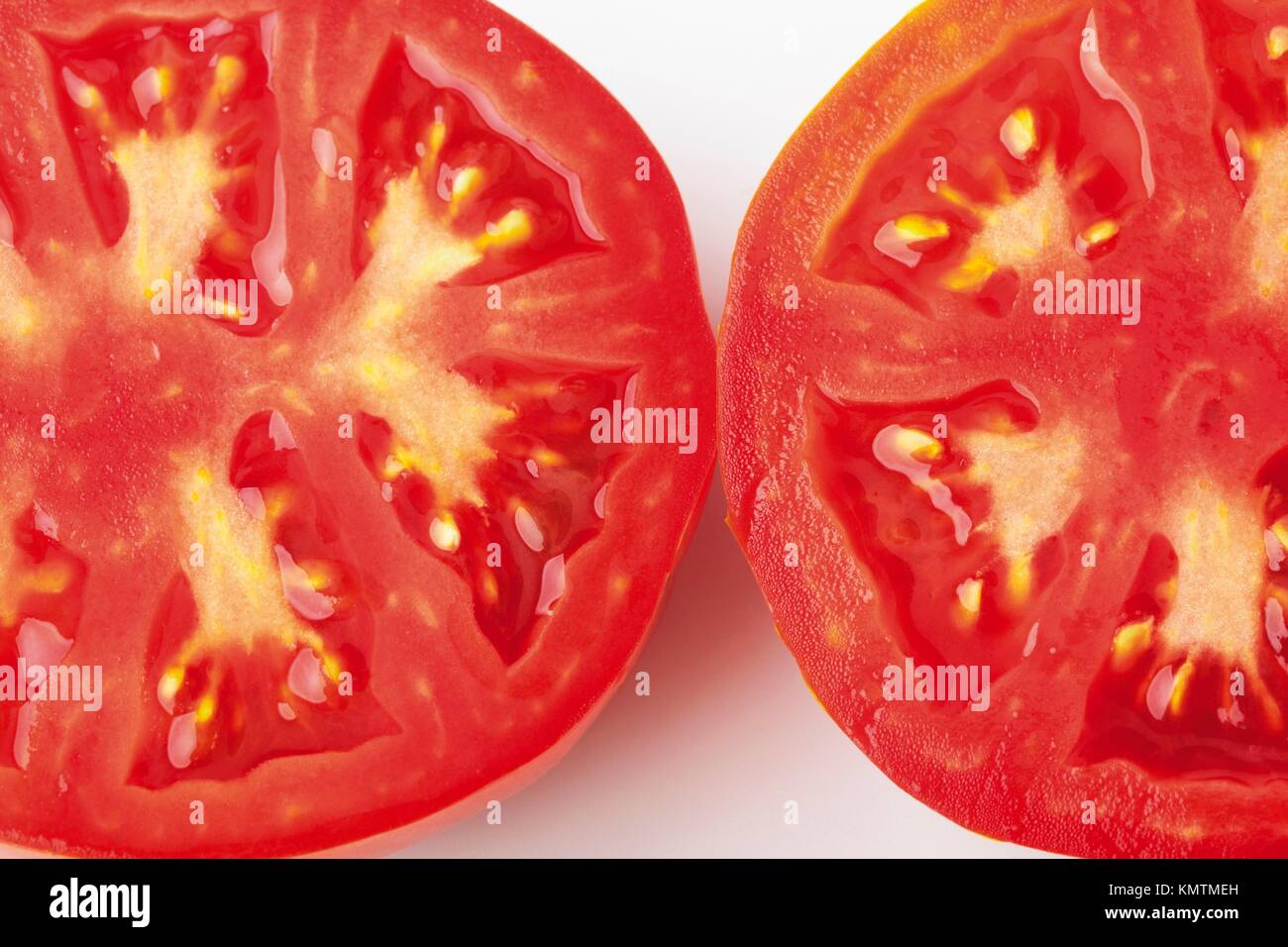 Halves cut in half tomato hi-res stock photography and images - Alamy