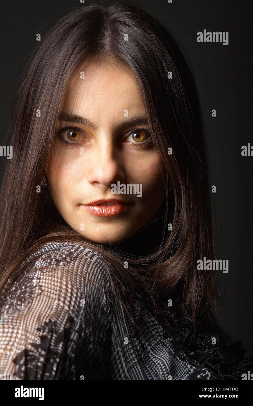 A very pretty woman looking over her shoulder Stock Photo - Alamy