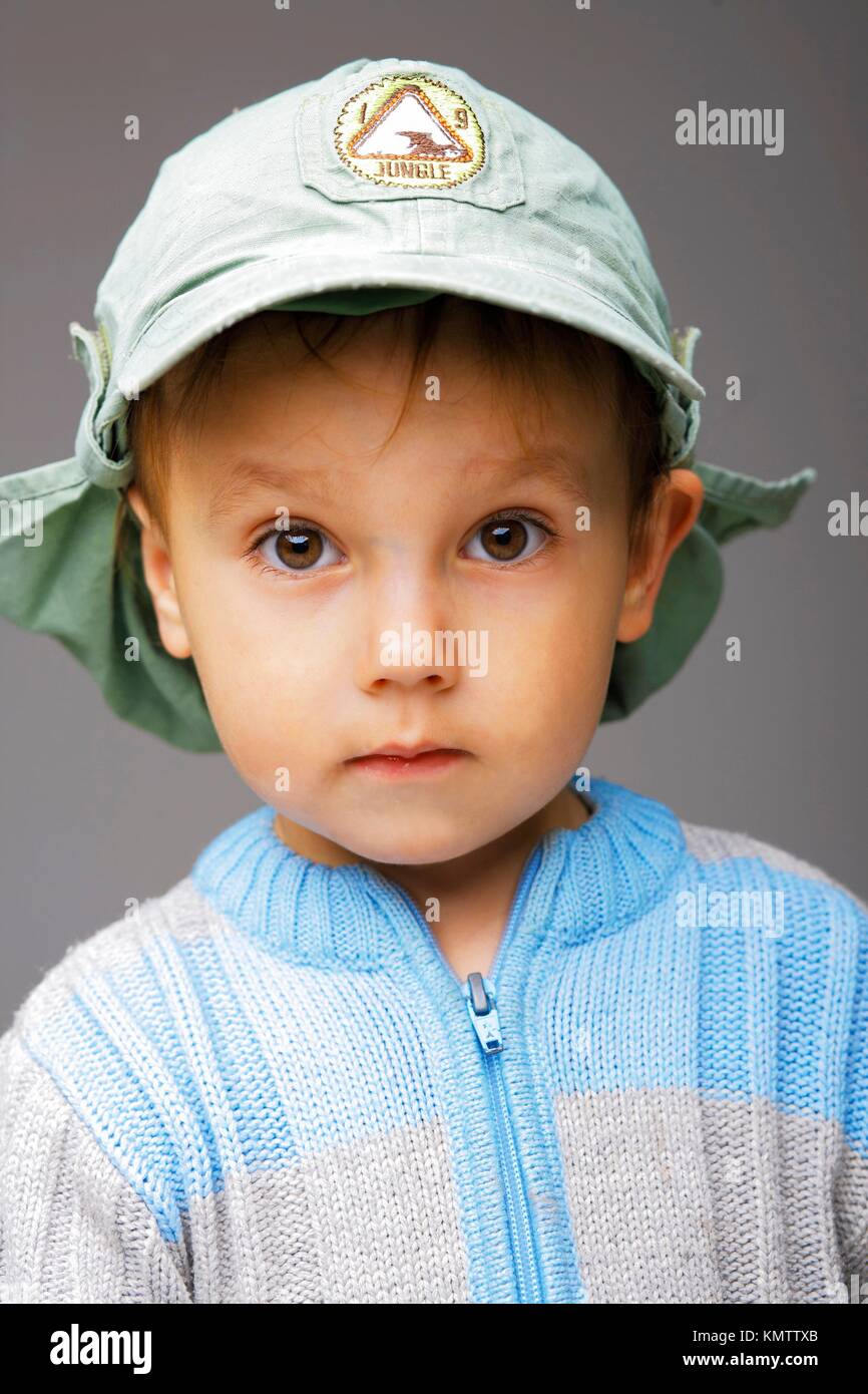 Closeup portrait of a little boy in a cap, serious attentive look Stock ...