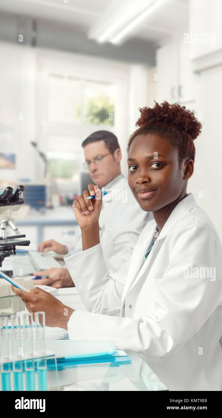 Woman wearing lab coat hi-res stock photography and images - Alamy