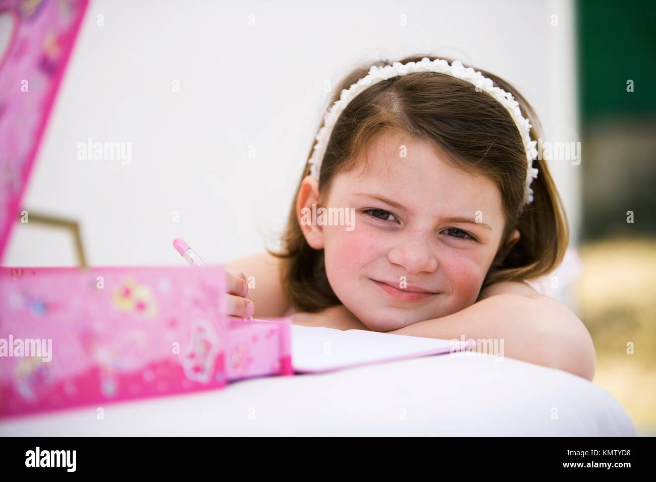 Pretty girl at home writing Stock Photo - Alamy