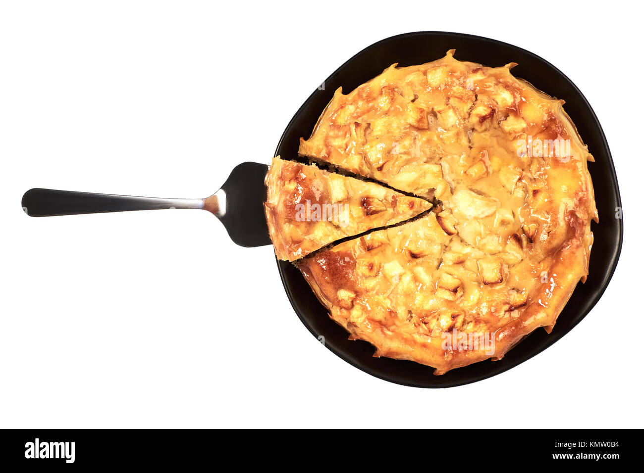 Homemade whole round apple pie, top view. A piece can be taken out on a ...