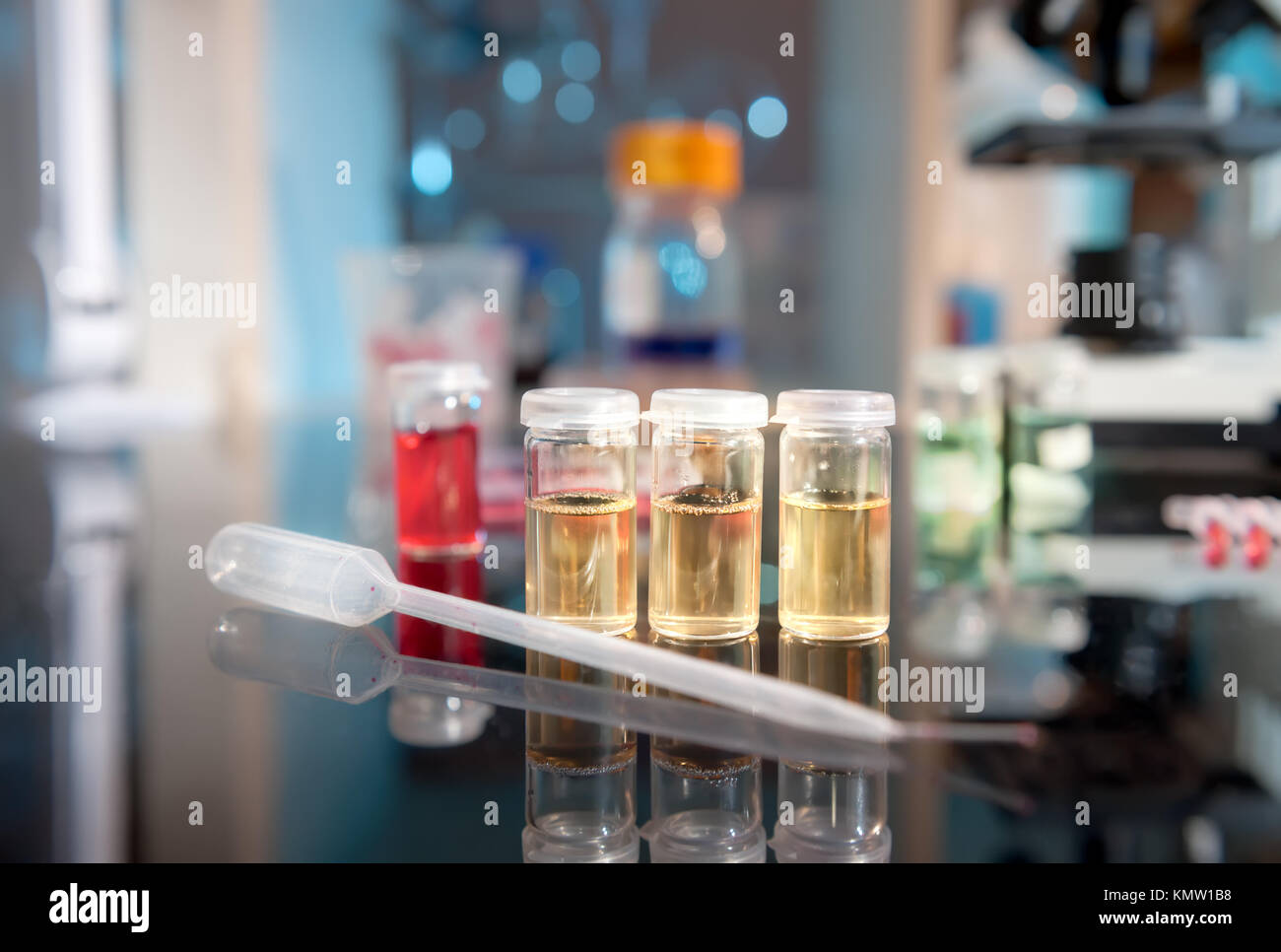 Liquid bacterial cultures on the bench, shallow DOF Stock Photo - Alamy