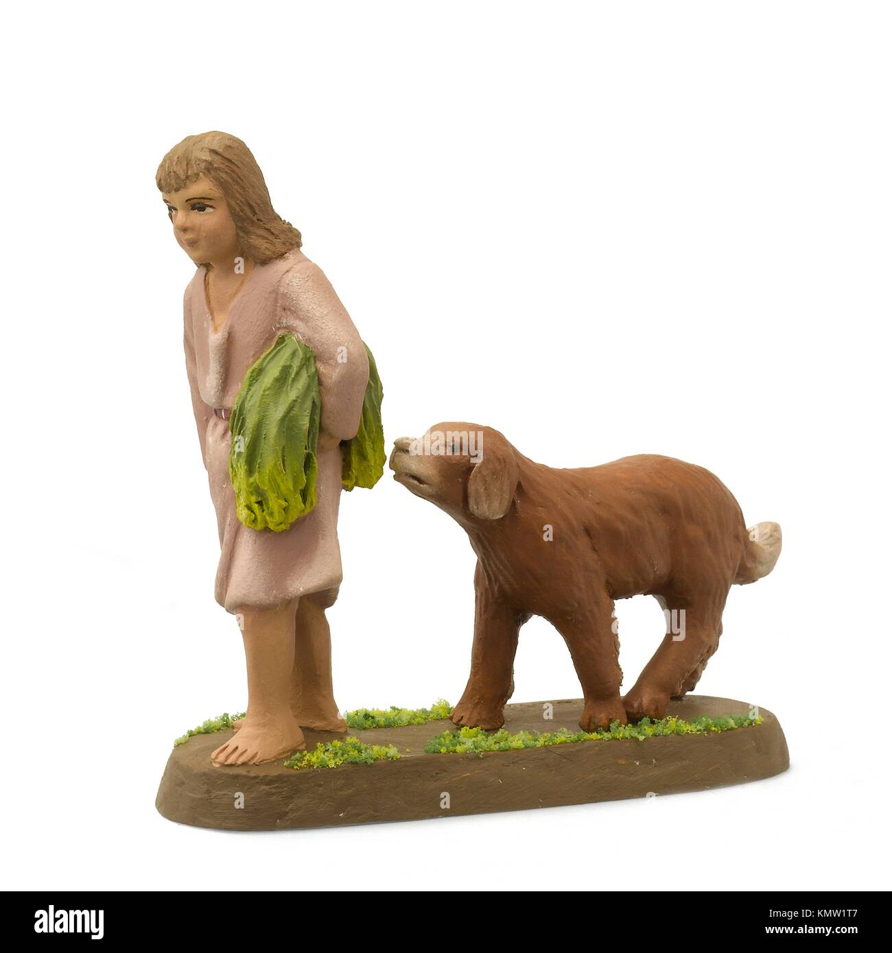 Nativity figures Girl and dog Stock Photo - Alamy