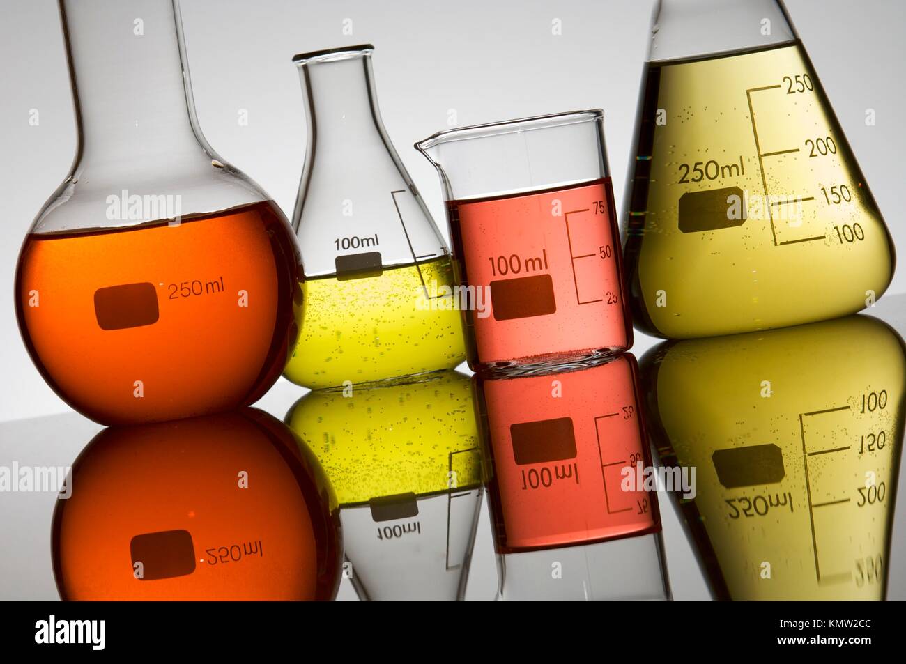 group of bottles of colored liquid laboratory Stock Photo - Alamy