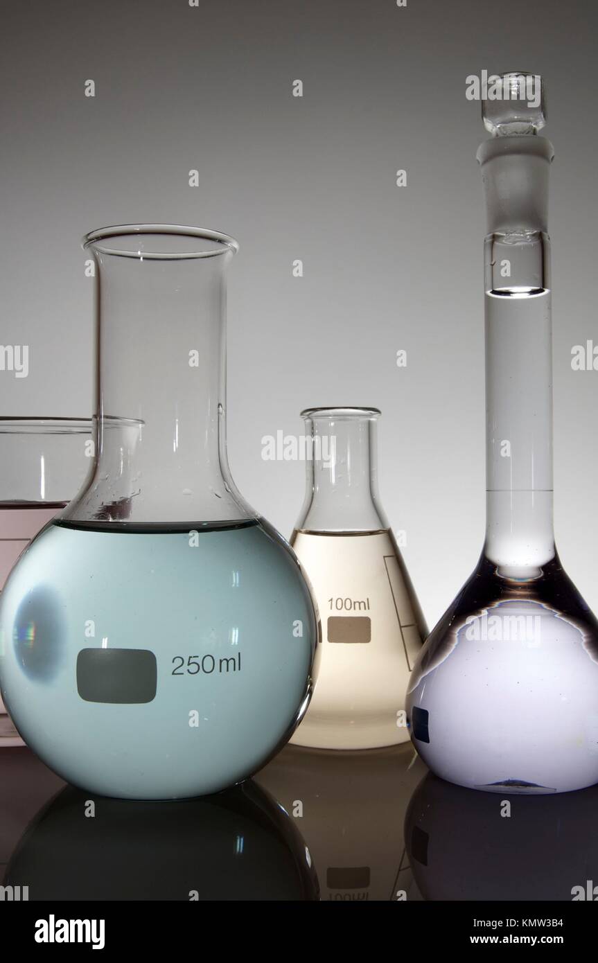 flasks group with color liquid and white background Stock Photo - Alamy