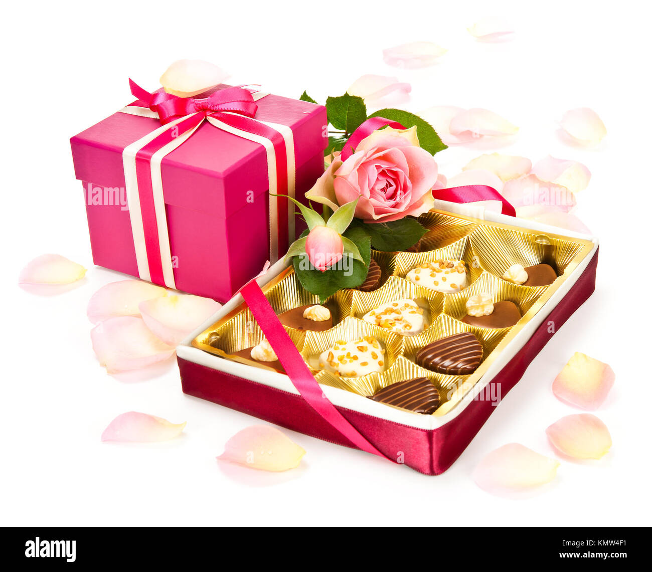 Box of chocolate pralines, rose and a pink gift box for Valentine Stock ...