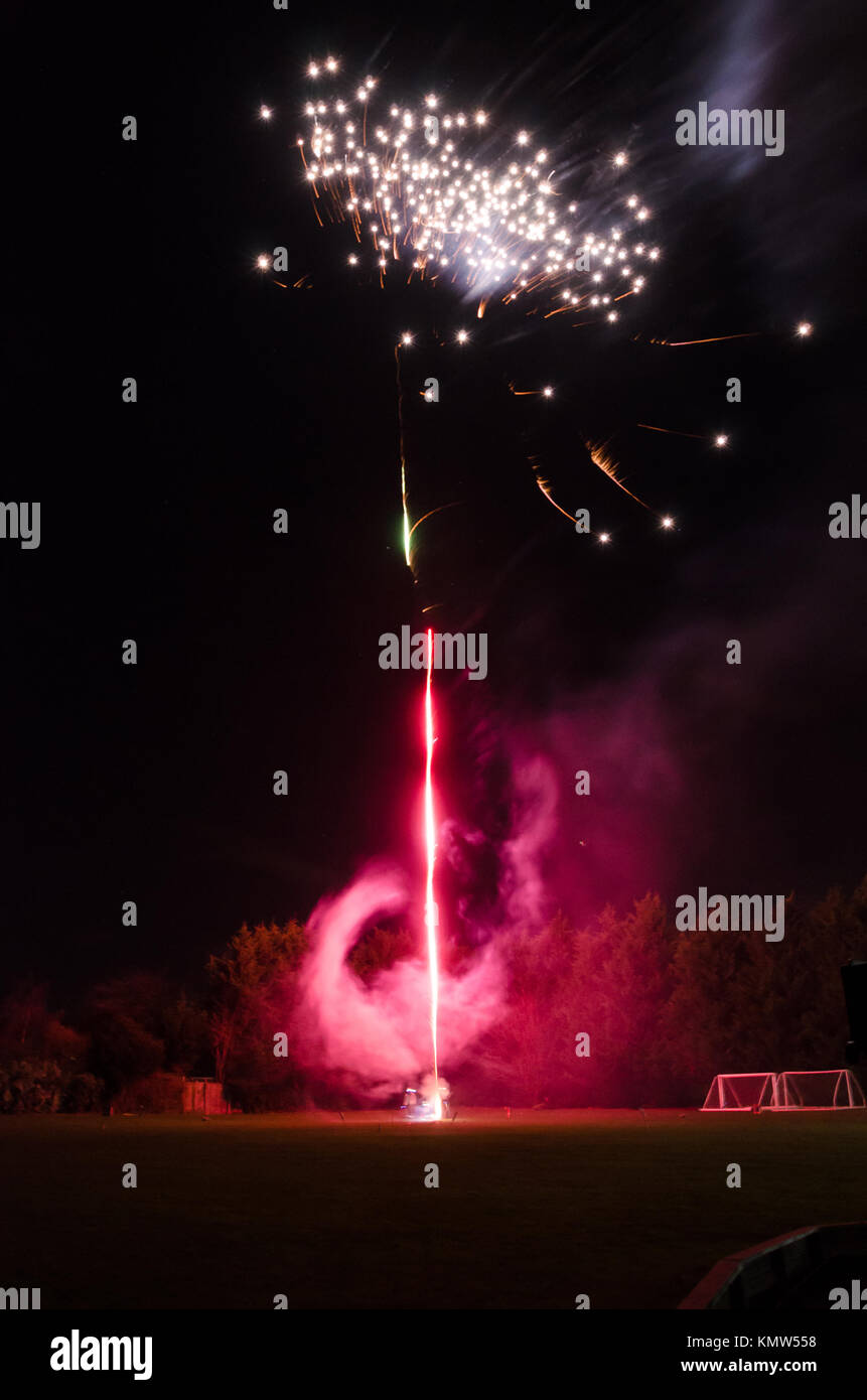 Fireworks launching into the sky and exploding at a public display ...