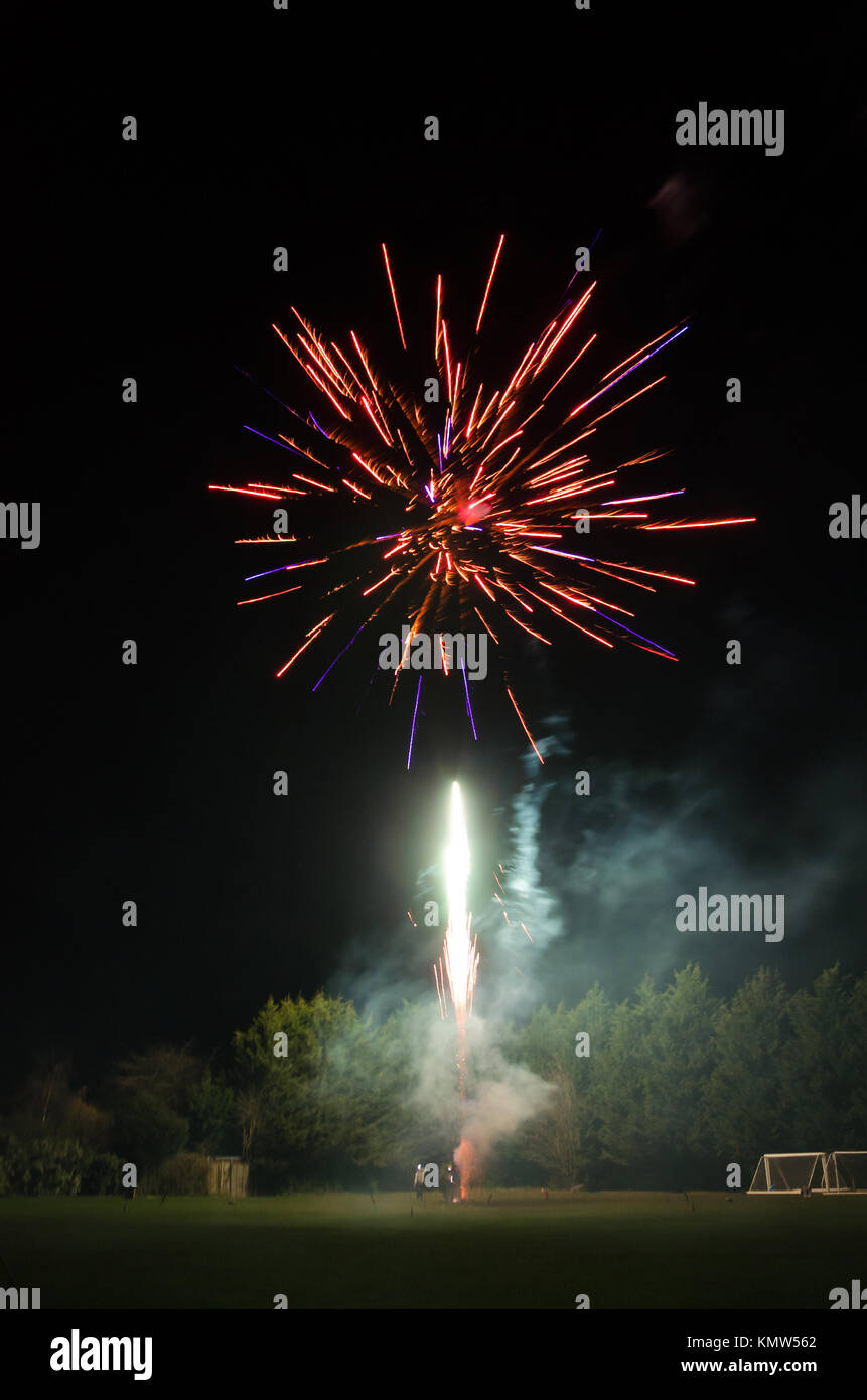 Fireworks launching into the sky and exploding at a public display ...