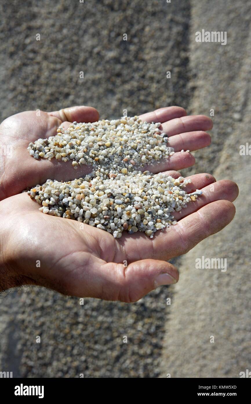 Gravel sand in man hands hi-res stock photography and images - Alamy