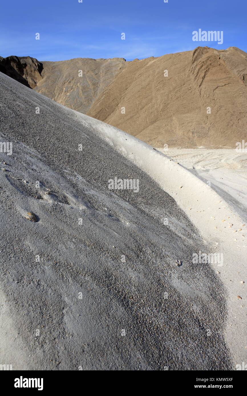 sand quarry mounds of varied construction sands Stock Photo - Alamy