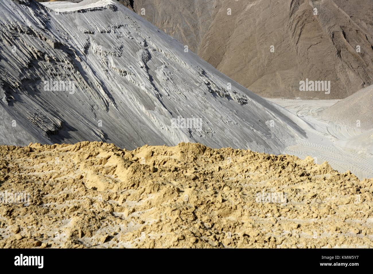 sand quarry mounds of varied construction sands Stock Photo - Alamy