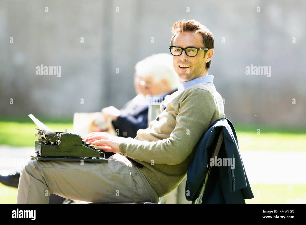 man writing on a vintage typewriter Stock Photo - Alamy