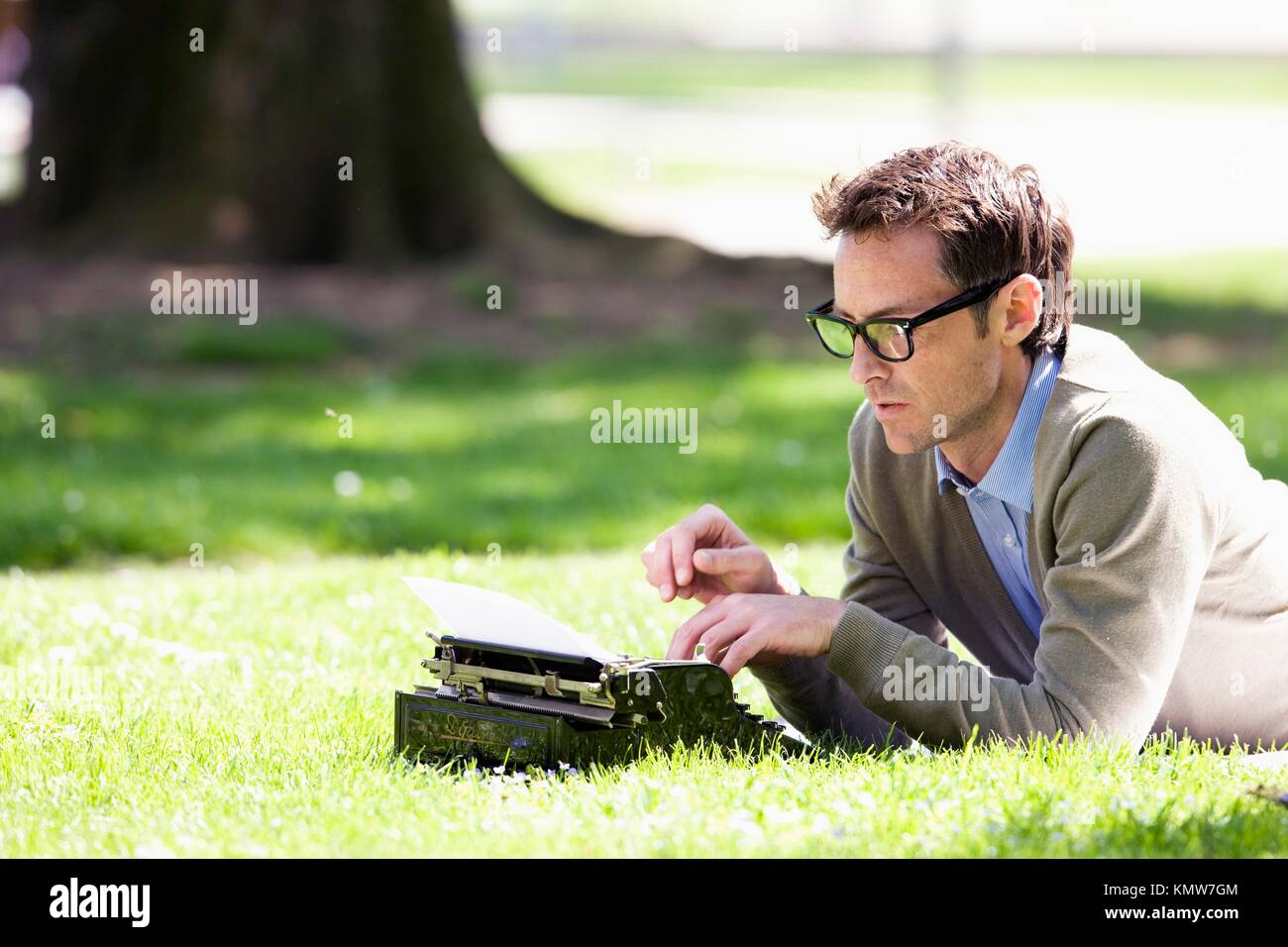 man writing on a vintage typewriter Stock Photo - Alamy