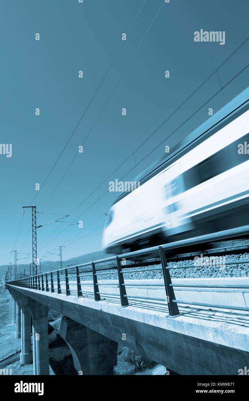 Blue speed train with clear sky Stock Photo - Alamy