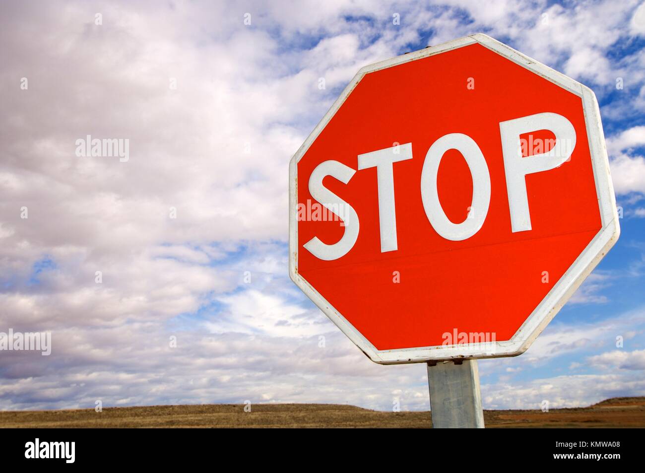red stop signal with cloudy sky Stock Photo - Alamy