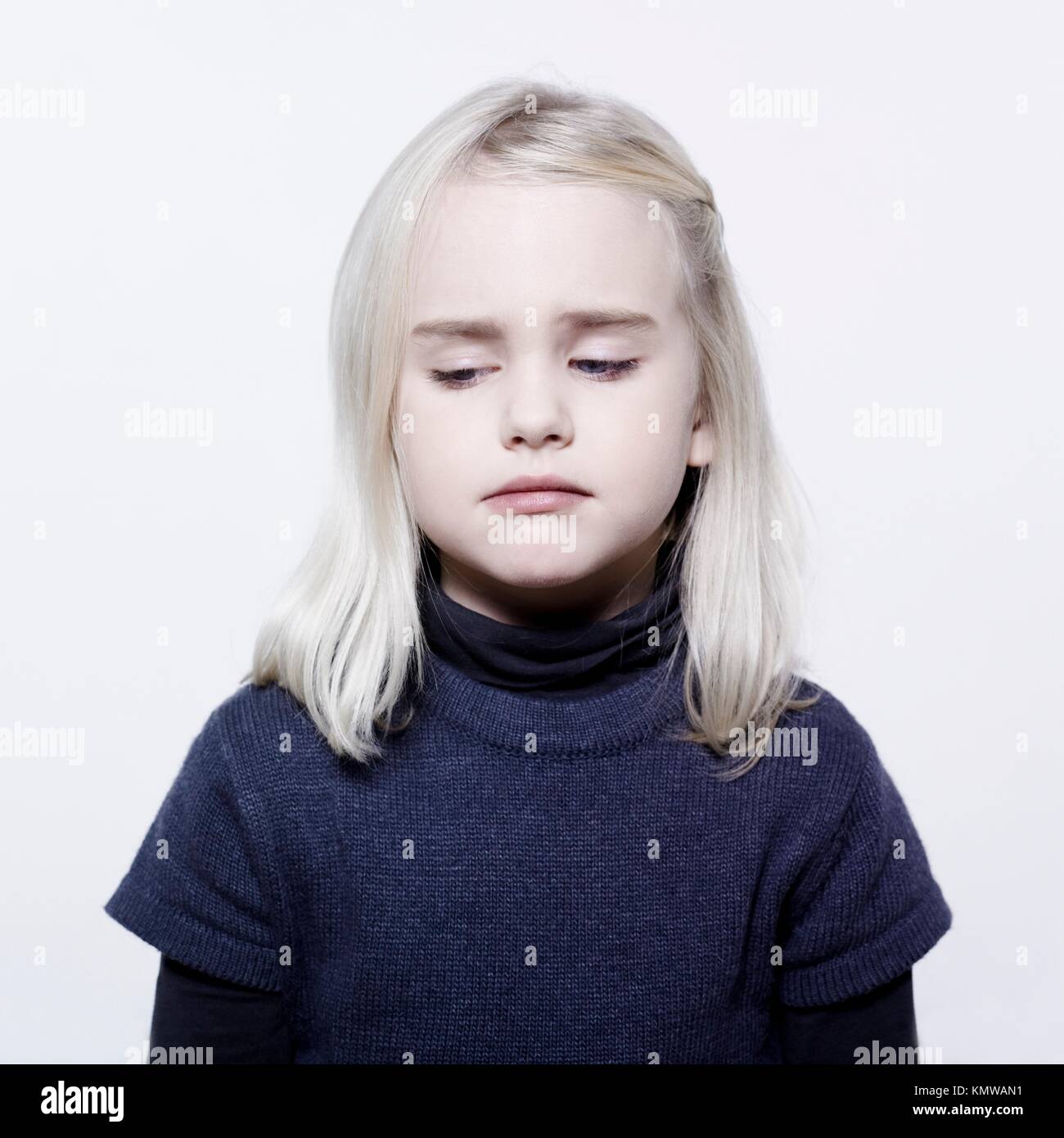 Cute blond girl frowning hi-res stock photography and images - Alamy