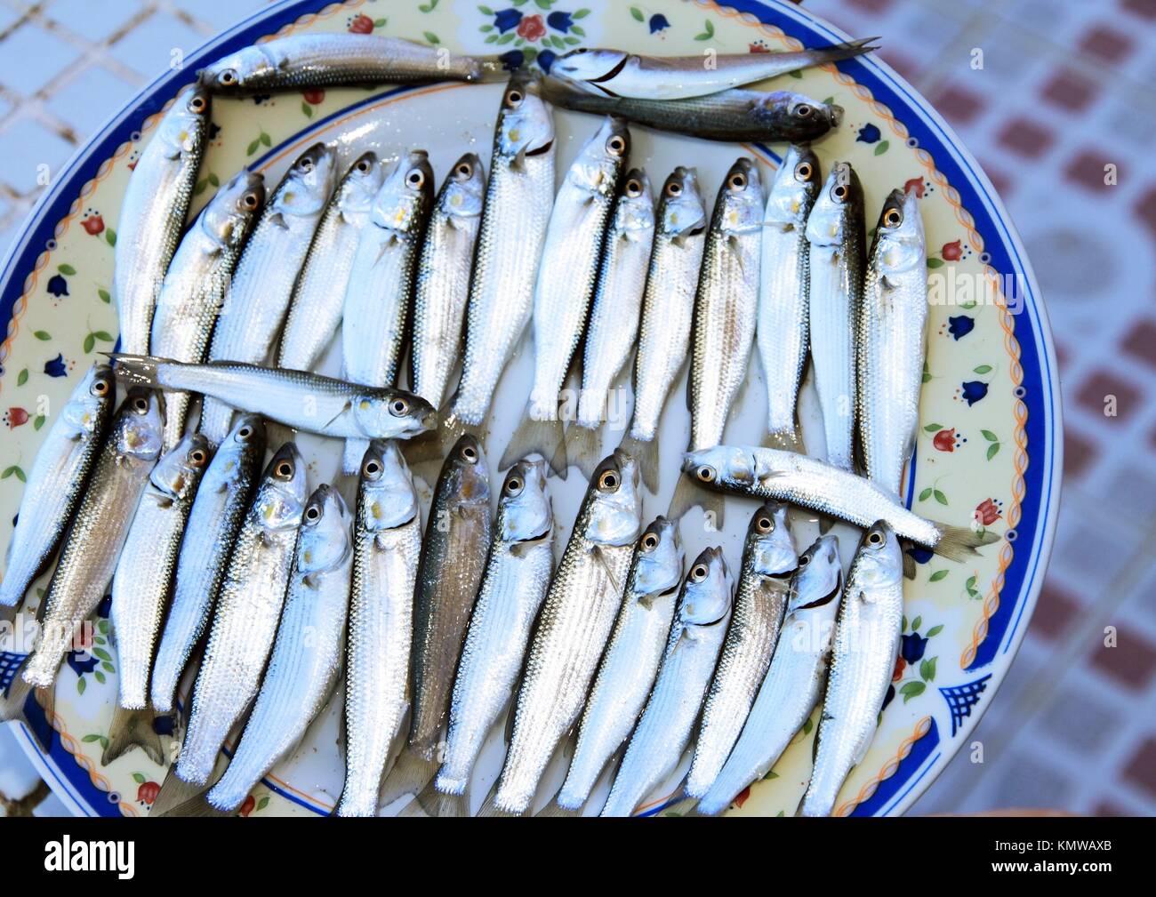 Tiny fried fish hi-res stock photography and images - Alamy