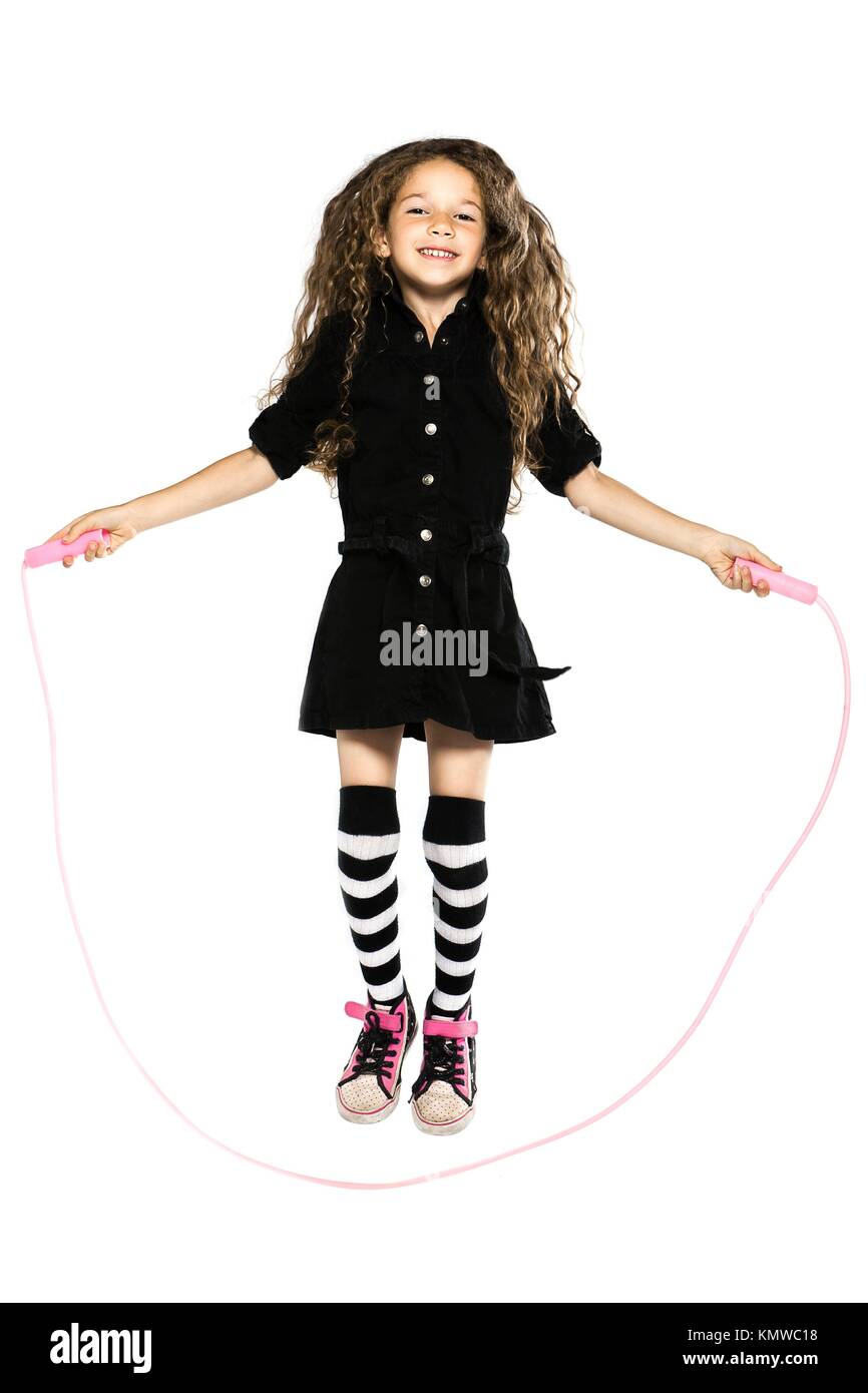 Girl playing skipping rope looking hi-res stock photography and images ...
