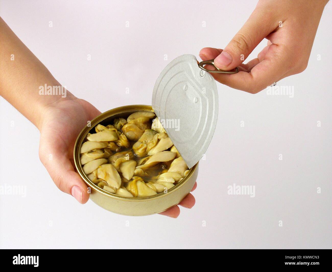 Opening a tin can hi-res stock photography and images - Alamy