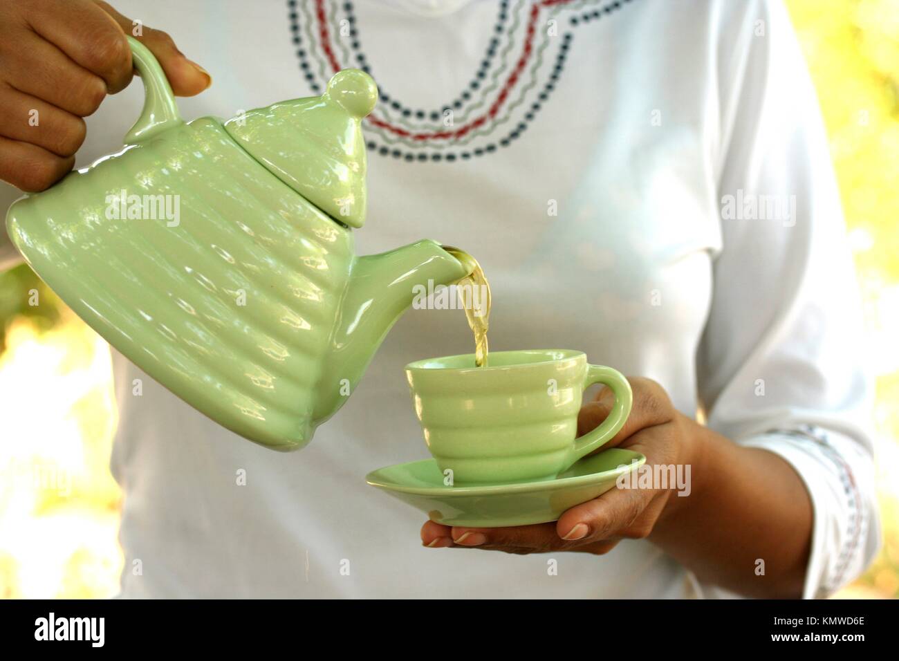 Indian woman with teapot hi-res stock photography and images - Alamy